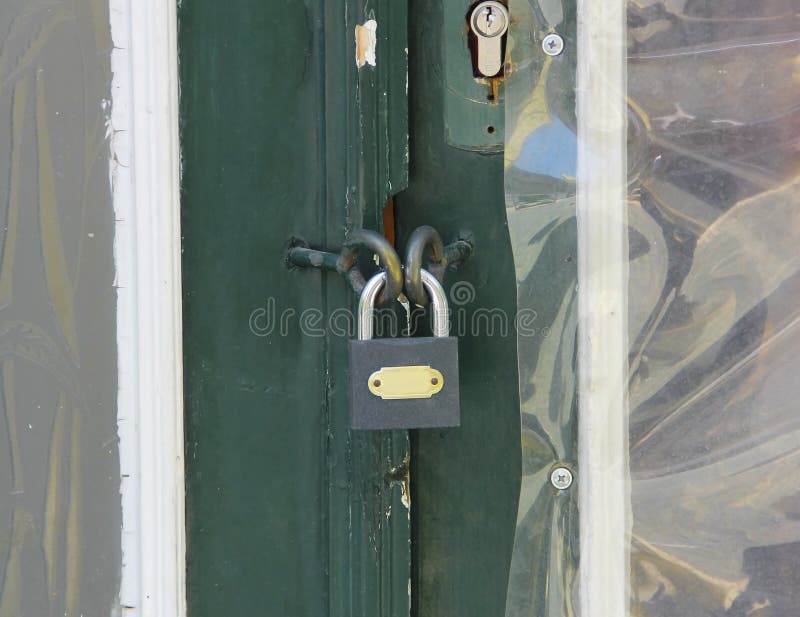 Metal lock on closed doors stock image. Image of locking - 222740577