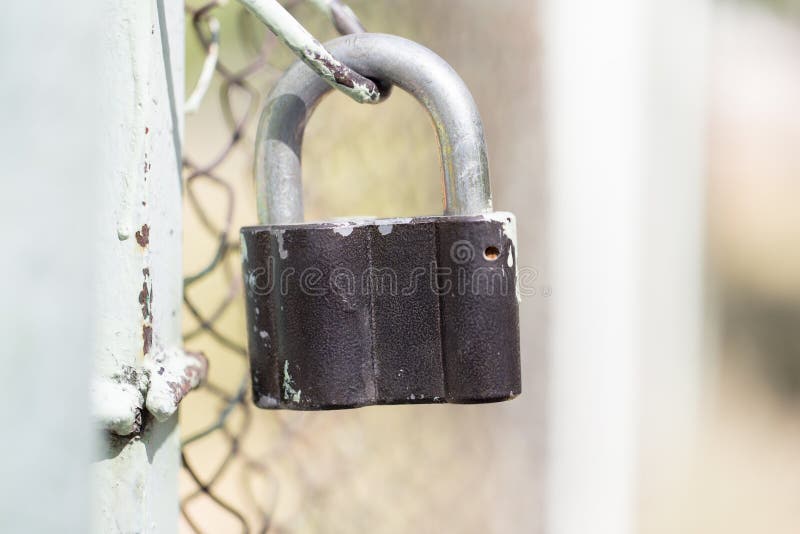 Metal lock on the fence stock image. Image of abandoned - 100383795