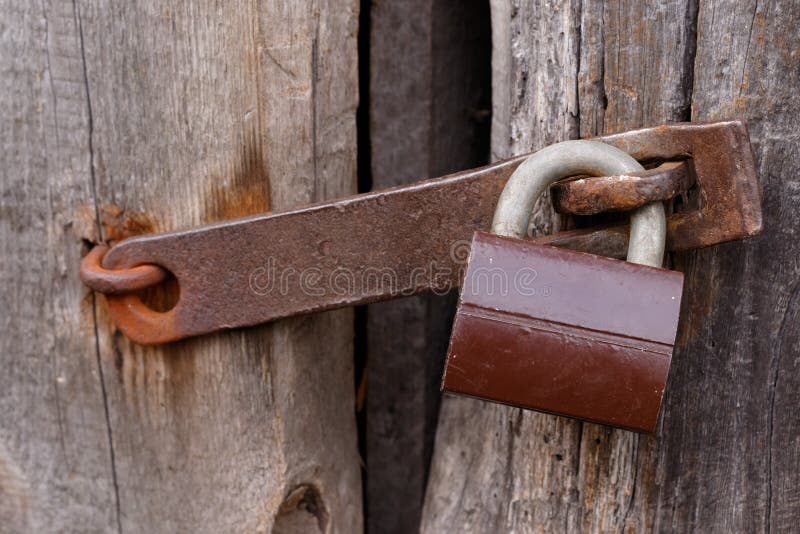 Old Rust Lock Key With Chain On Grey Cement Wall. Security Concept ...