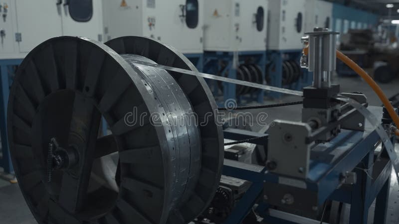 Metal Long Narrow Sheets Wraping on a Bobbin. Creative. Large Spool in ...