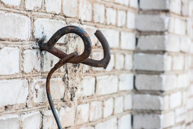 Metal Loop in the Brick Wall Stock Photo - Image of close, rust: 129128508