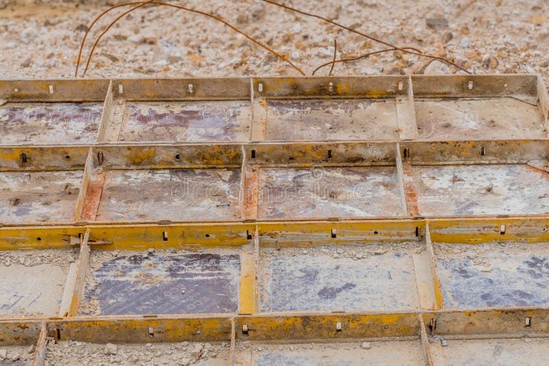 Metal Masonry Forms Laying on Ground Stock Photo - Image of build, site ...
