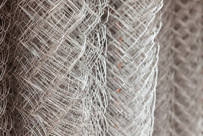 Metal Mesh Netting Rolled into Rolls. Rolled Chain-link Fence. Stock ...