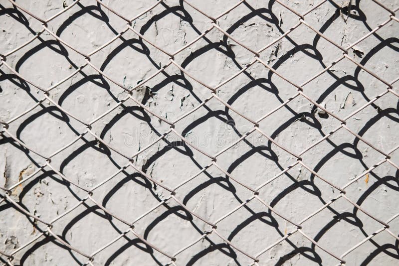 Metal Mesh Pattern on Concrete Wall Background with Shadow. Abstract ...