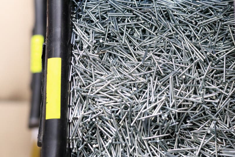 . Metal Nails. Arranged in a Dark Colored Spot. Shallow Depth of Cut ...