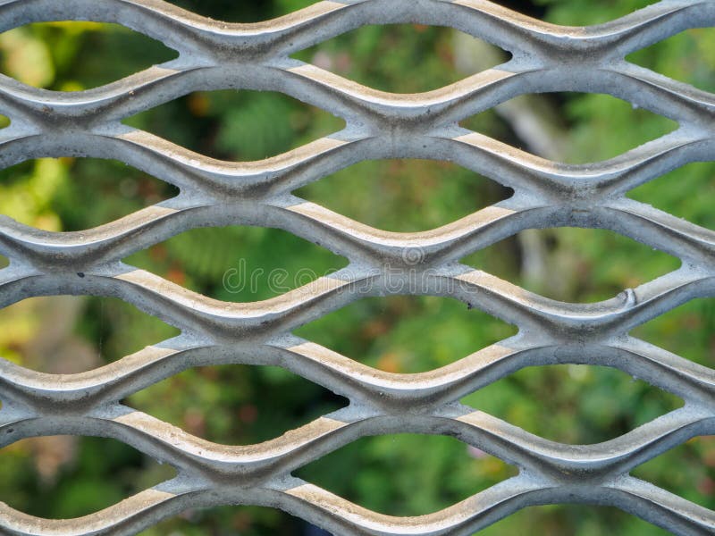 Metal Net with Green Blured Background. Stock Photo - Image of ...