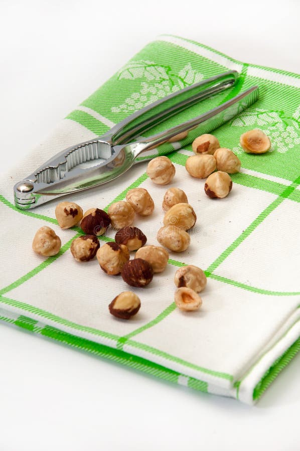 Metal Nutcracker on a Green Rag with Nuts Stock Image - Image of ...