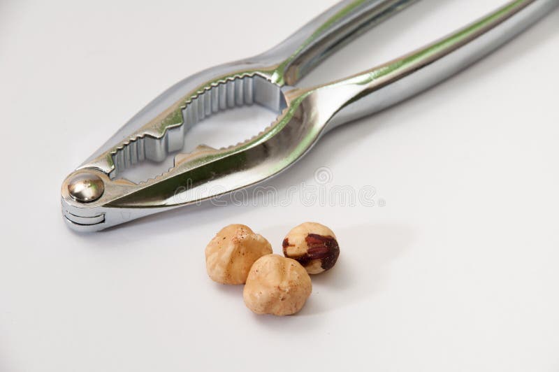 Metal Nutcracker with Nuts on a White Background Stock Image - Image of ...
