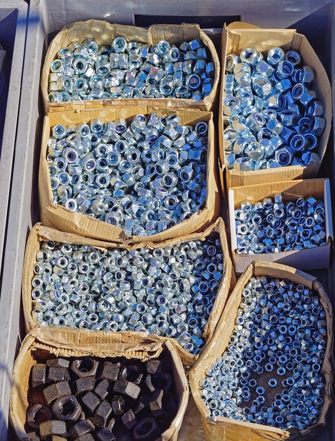 Metal nuts in boxes stock image. Image of bolts, equipment - 354020101