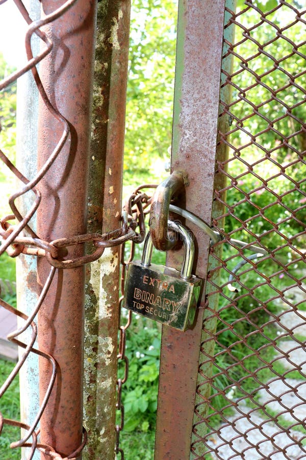 Metal Padlock Extra Binary Top Security on the Gate Stock Photo - Image ...