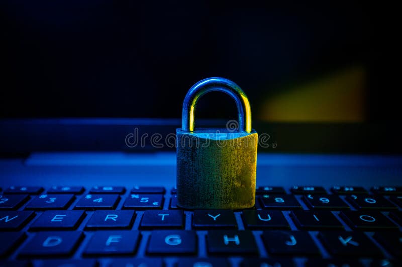 Metal Padlock on Laptop Keyboard in Blue and Yellow Light Stock Image ...