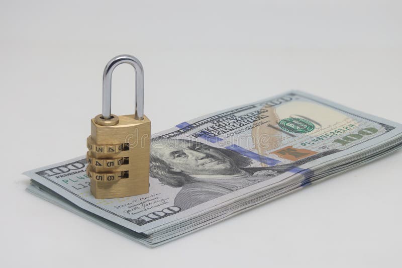 Metal Padlock and Money on a White Background. a Stack of Hundred ...