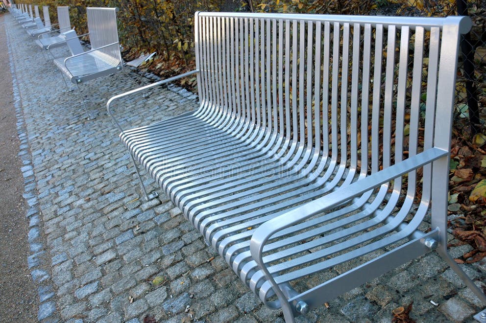 Metal park benches stock image. Image of angle, path, modern - 1473875