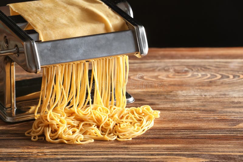 Metal Pasta Maker with Dough on Table Stock Image - Image of cooking ...