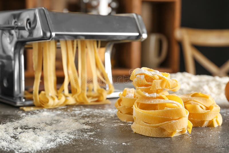 Metal Pasta Maker with Dough on Table, Closeup Stock Image - Image of ...
