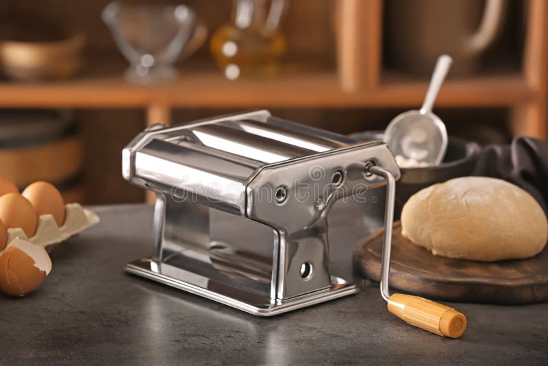 Metal Pasta Maker on Kitchen Table Stock Image - Image of ingredient ...