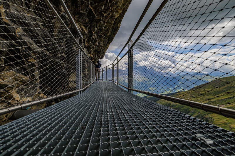 Metal Pathway Next To Stony Mountain in a Natural Area Under Cloudy Sky ...