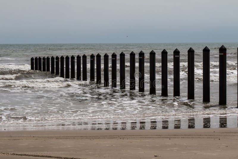 Metal Pilings from Shoreline into Ocean Stock Image - Image of break ...