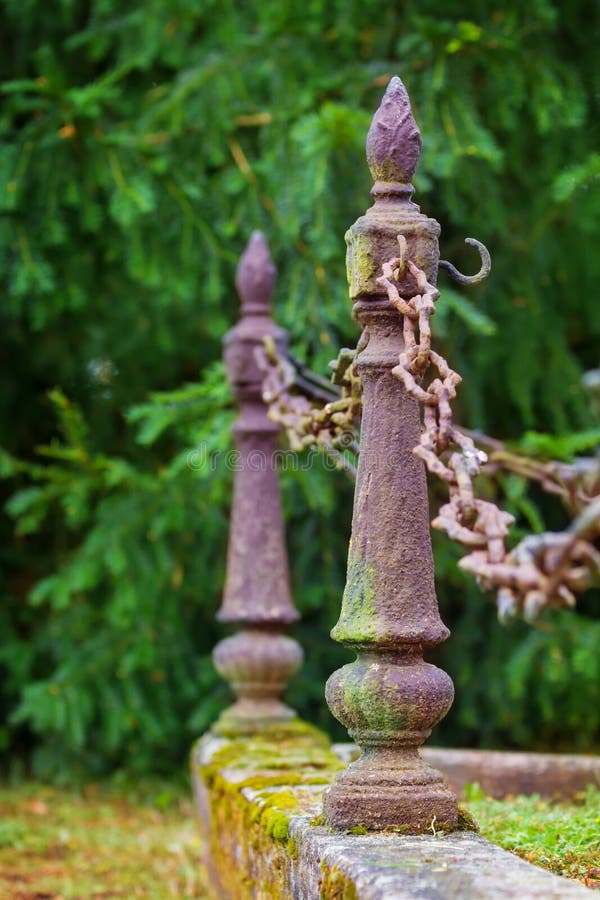 Metal pillars and chains stock photo. Image of iron, shrubs - 43252472