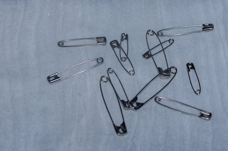 Metal Pins of Different Sizes on a White Background. Stock Photo ...