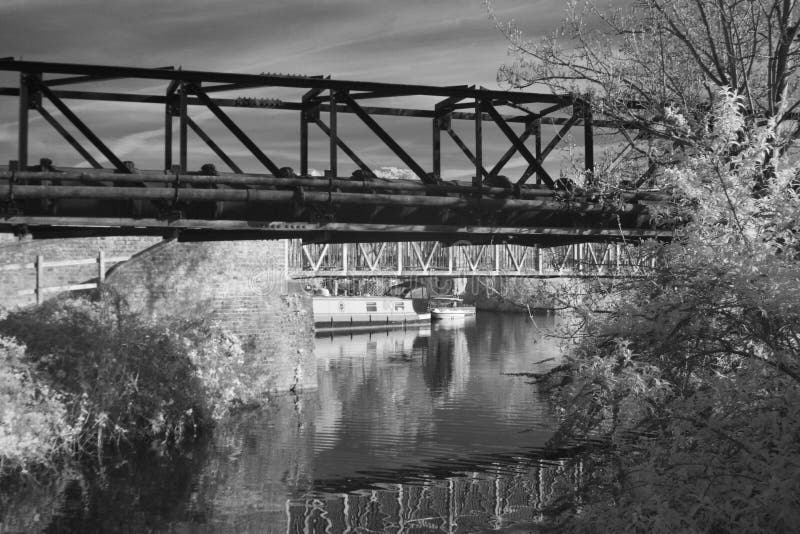 Metal Pipe Bridge Structures Reflected in Canal Water Stock Image ...