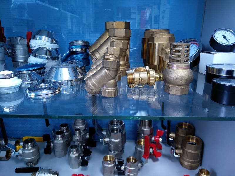 Metal Pipe Fittings on Glass Shelf Stock Image - Image of glass ...