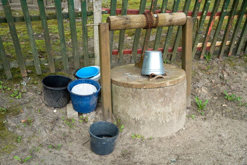 Metal and Plastic Water Buckets on Old Draw Well Stock Photo - Image of ...