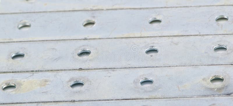Metal plate with holes stock image. Image of backdrop - 76539755