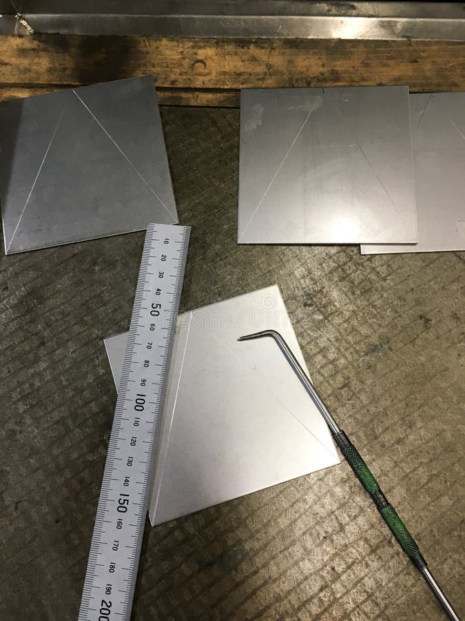 Metal Plates Cutting for Triangle Shape on Worktop Stock Image - Image ...