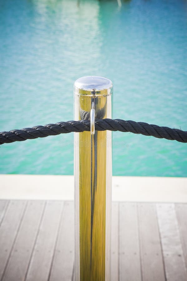 Metal Pole with Black Rope Isolated on Blue Backgrpund Stock Photo ...