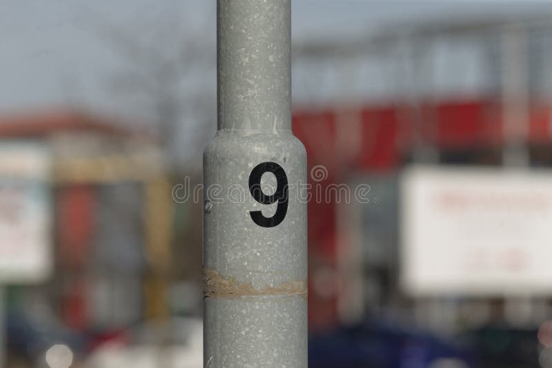 A Metal Pole Displaying the Number 9 Prominently on Its Surface Stock ...