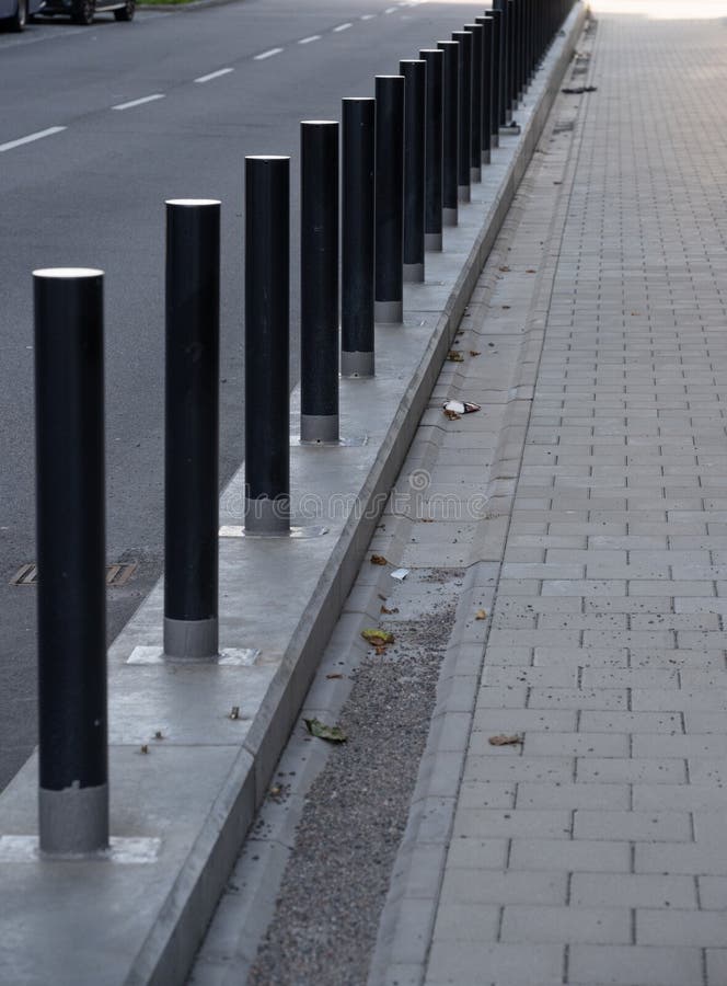 Metal Poles Protecting a Building and Sidewalk.. Stock Image - Image of ...