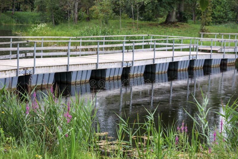 .metal Pontoon Bridge in the Park Over the Water Barrier Stock Photo ...