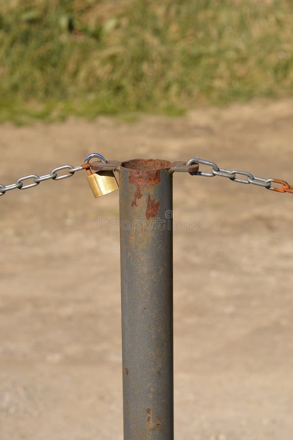 Metal Post with a Chain and Padlock Stock Image - Image of fence ...