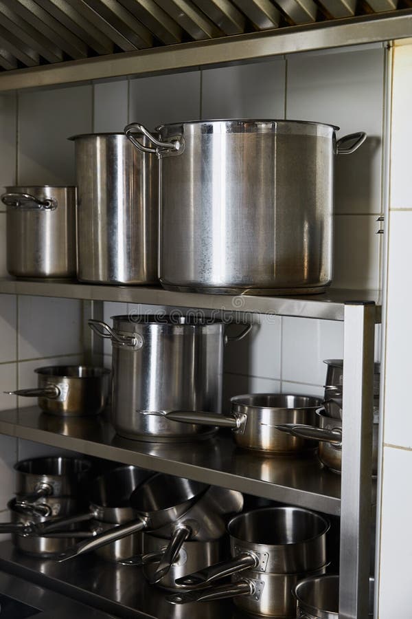 Metal Pots on Rack at Kitchen Stock Photo - Image of household ...