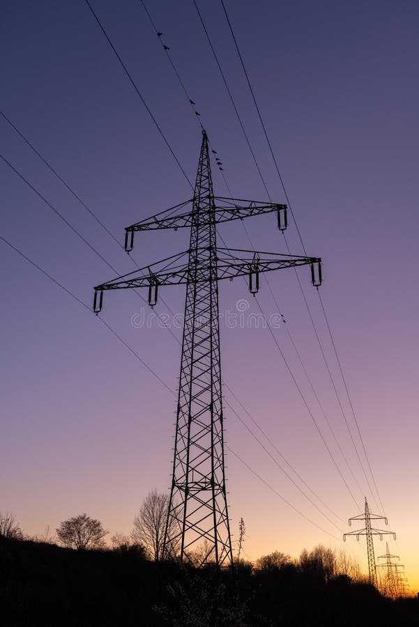 Metal power pylon at dusk stock photo. Image of electricity - 176492742