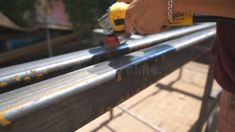 Metal Processing with Circular Saw Tool. Hands of Mechanic Holding ...