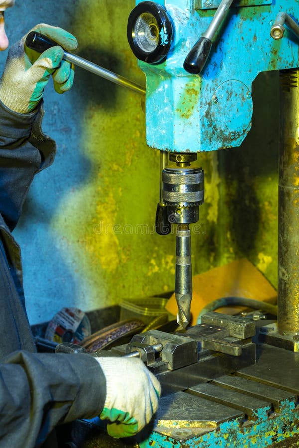 Metal Processing Concepts. Professional Fitter Man Using Metal Drilling ...