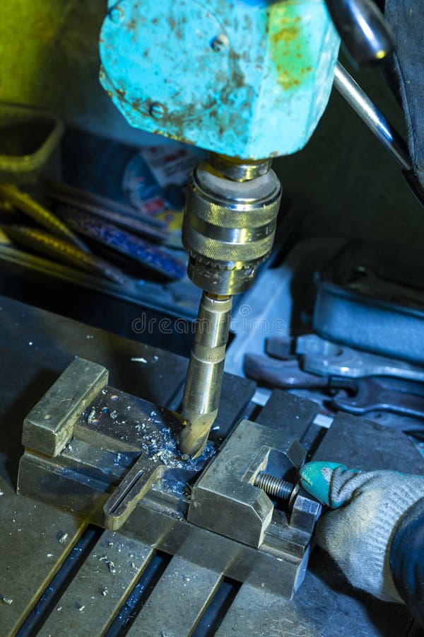 Metal Processing Concepts. Professional Fitter Man Using Metal Drilling ...