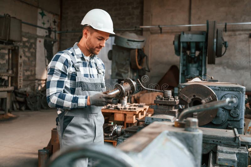 Metal Processing. Factory Male Worker in Uniform is Indoors Stock Image ...