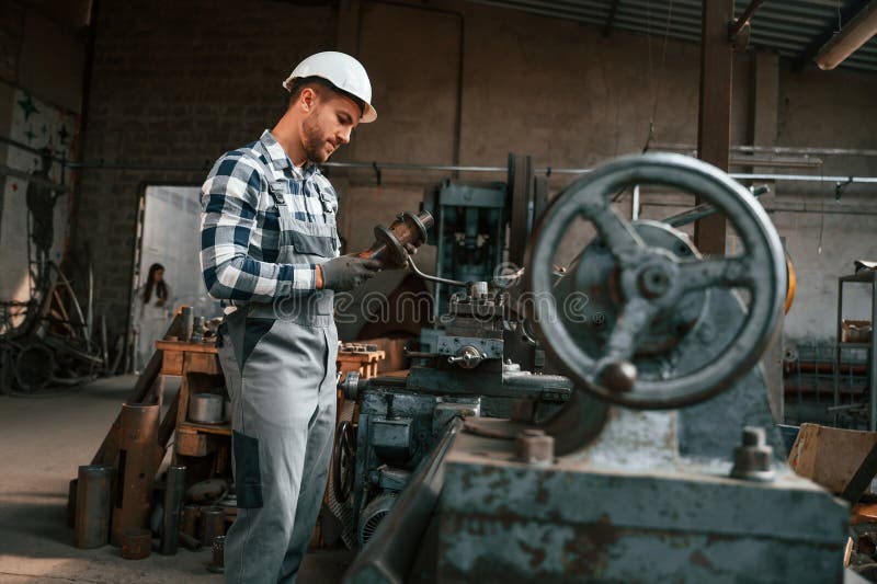 Metal Processing. Factory Male Worker in Uniform is Indoors Stock Photo ...