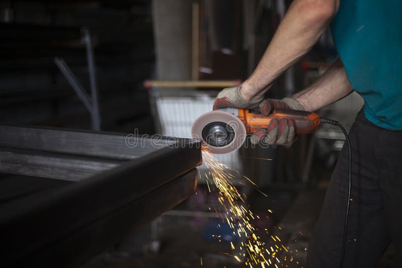 Metal Processing. Grinder in Hand. Worker Holds Tool Stock Image ...