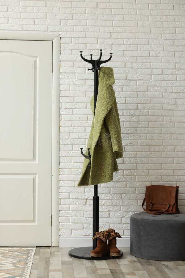 Metal Rack with Green Coat and Shoes in Hallway Stock Image - Image of ...