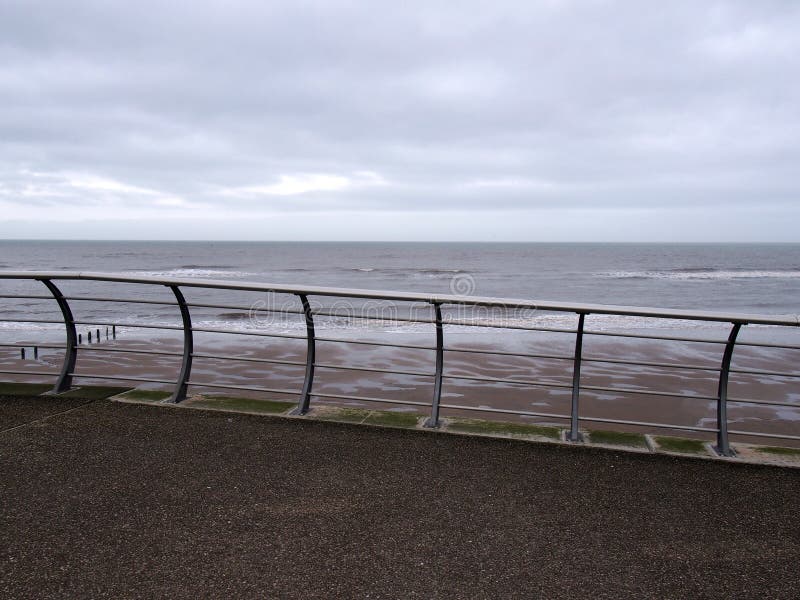 Railings on the Seafront in Blackpool with Waves Breaking on the Beach ...