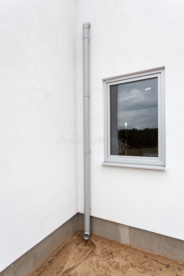 Metal Rain Gutter on a White Wall with Window Stock Photo - Image of ...