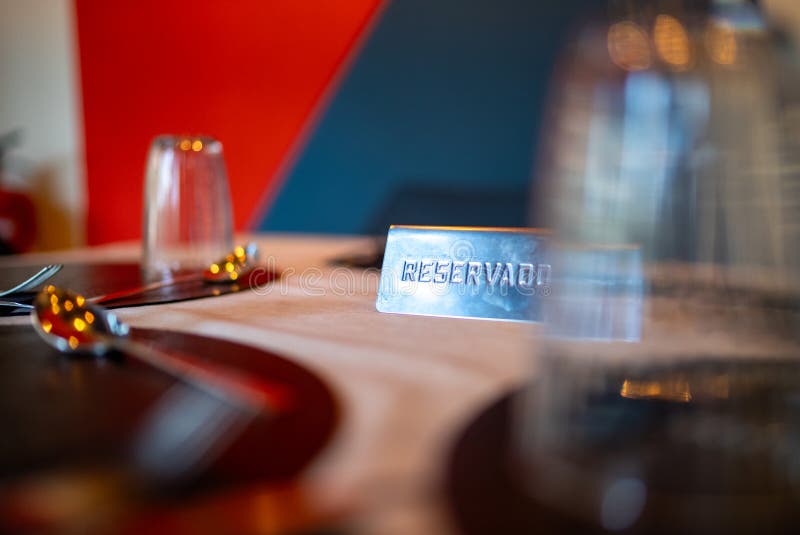 Metal Reserved Sign Placed on Elegantly Set Restaurant Table ...