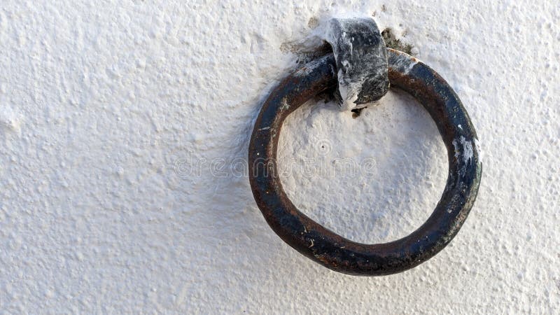 The Metal Ring is Fixed in the Wall Painted White Stock Image - Image ...