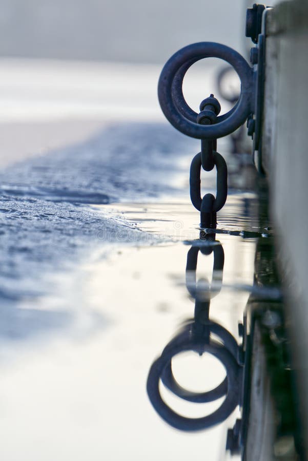 Metal Rings and Chain on Bridge Stock Photo - Image of ring, reflection ...