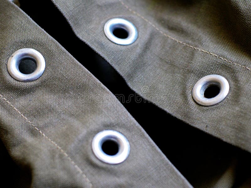 Metal Rivet Ringlet Eyes In Heavy Green Canvas Stock Photo - Image of ...
