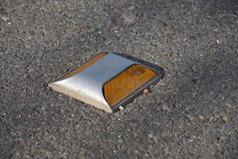 Metal Road Stud with Yellow Reflector on Asphalt Road in Thailand Stock ...